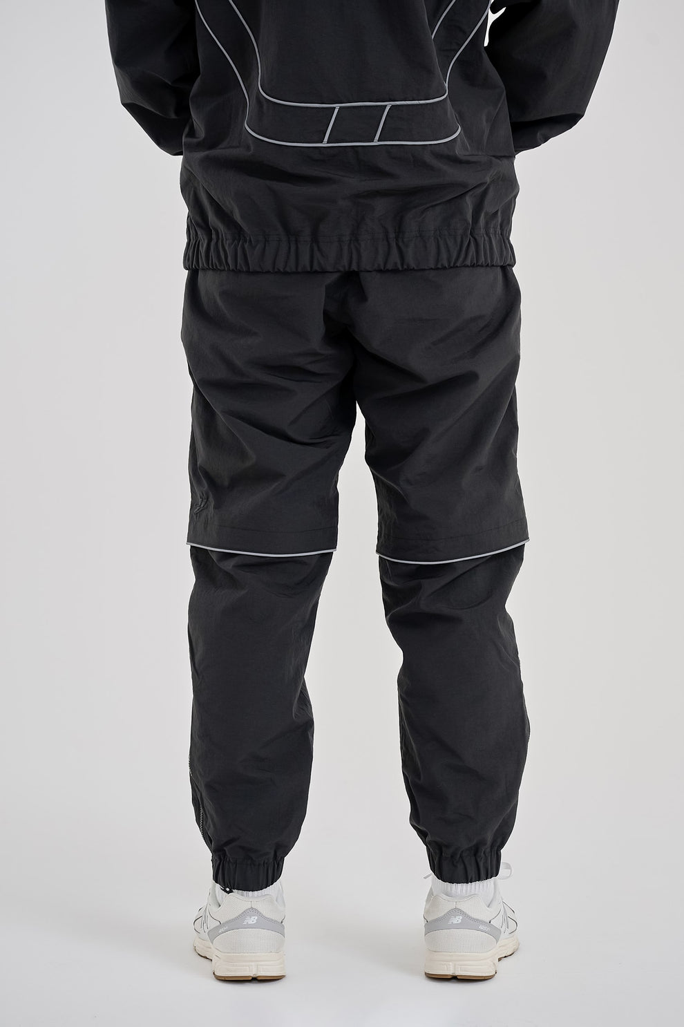Reflective woven track pants – U SLASH